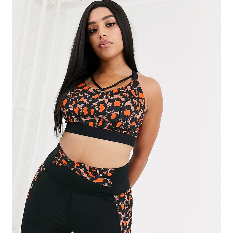 Wolf & Whistle curve leopard print sports bra with cross detail back in ...